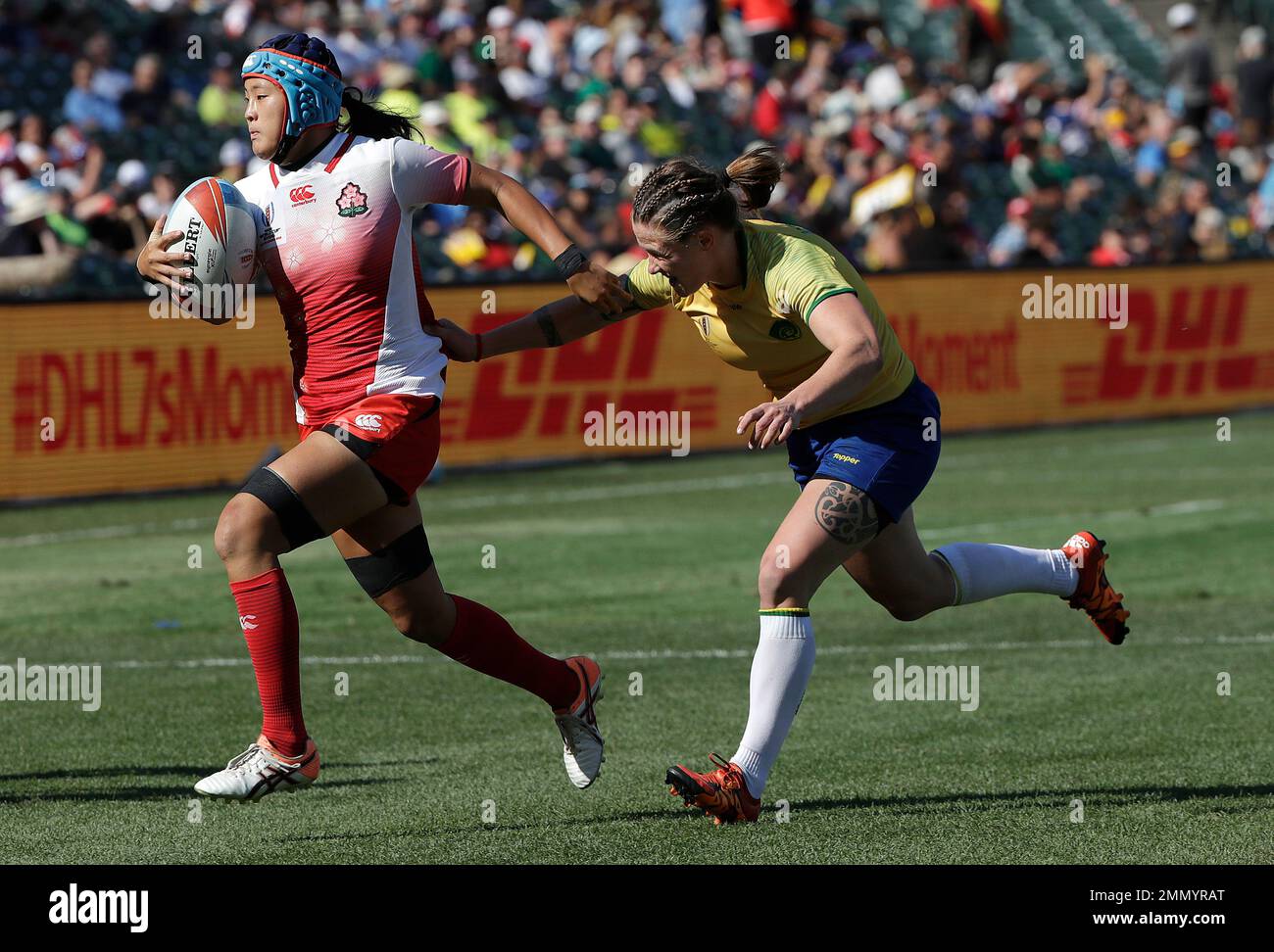 Japan's Yukari Tateyama, left, runs against Brazil's Raquel Kochhann ...