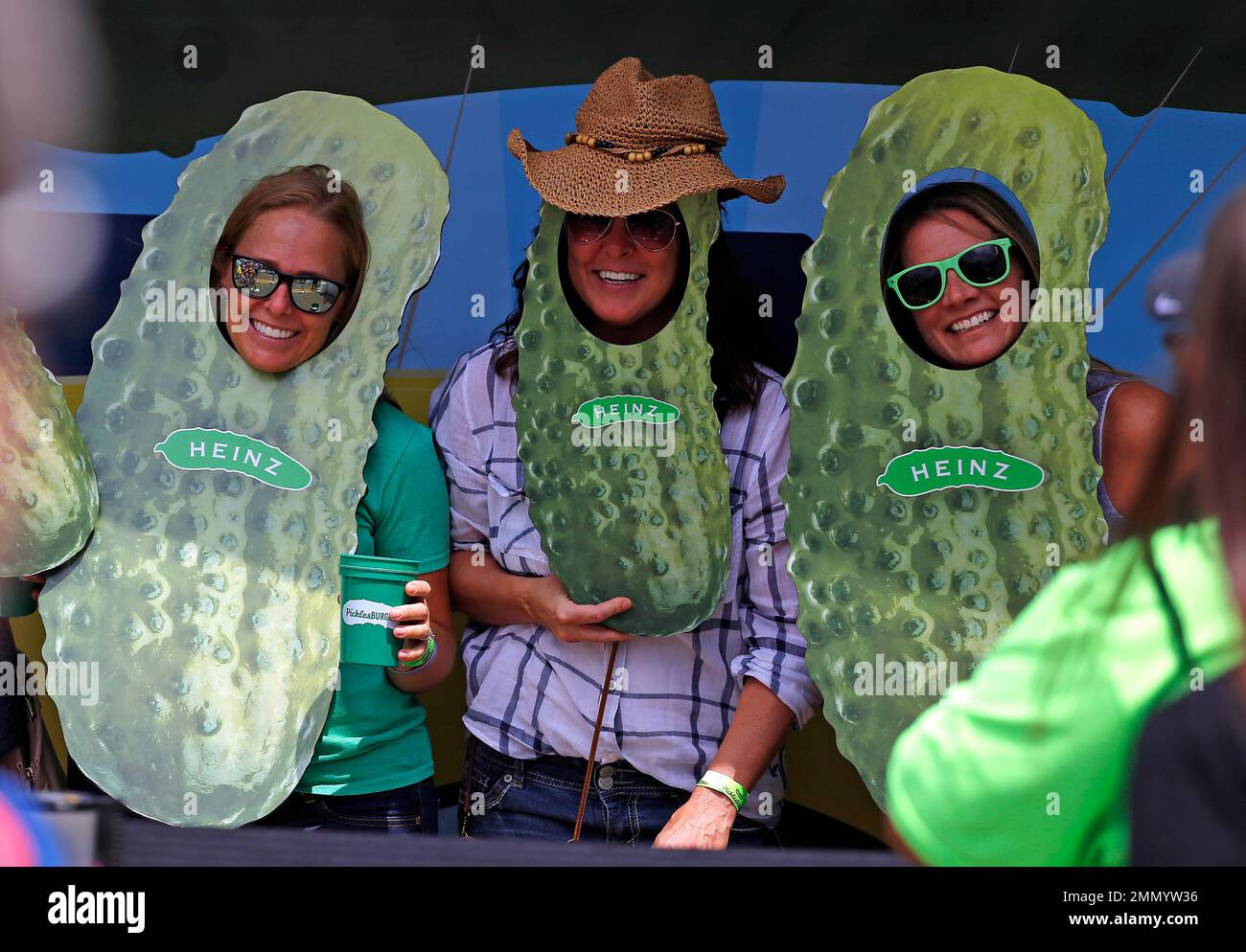 Picklesburgh Festival goers have pickle portraits taken in a photo ...