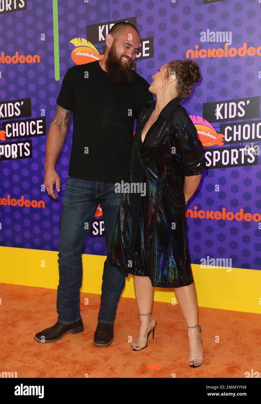 Ronda Rousey, right, and Travis Browne arrive at the Kids' Choice ...