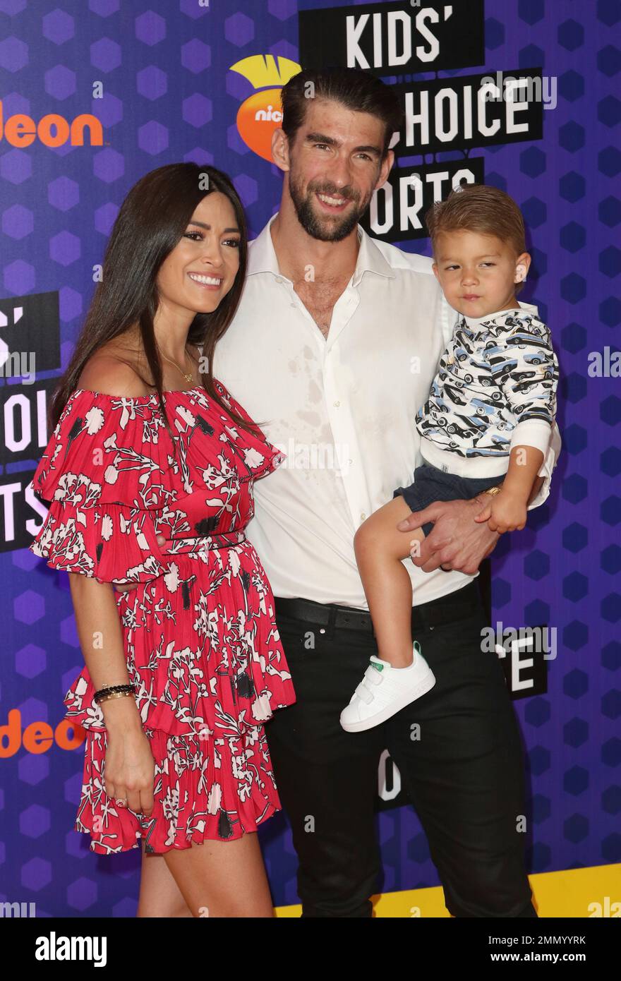 Swimmer Michael Phelps, center, Nicole Johnson, from left, and Boomer ...