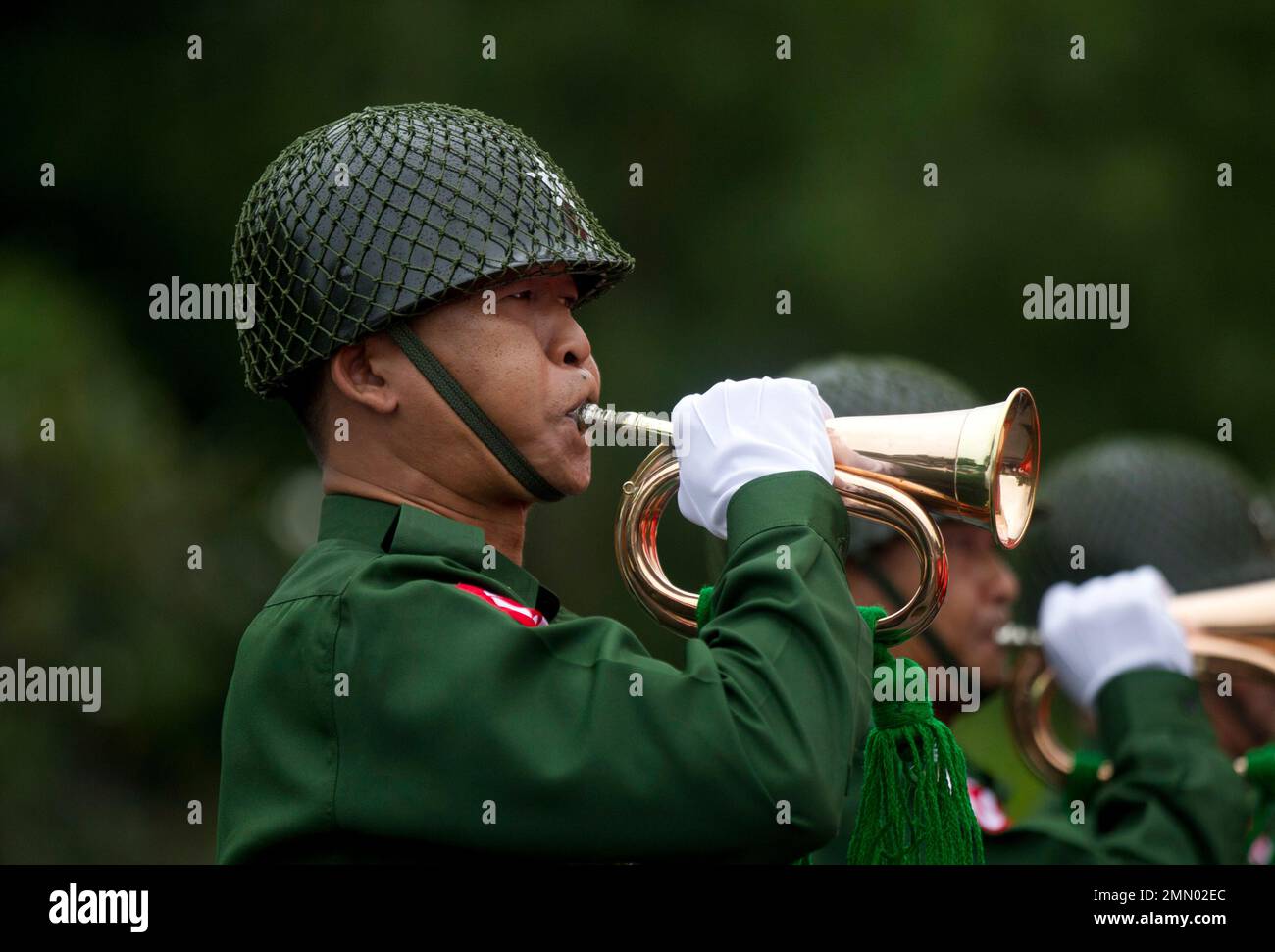 Myanmar's soldiers play the bugle during a ceremony to mark the 71st ...