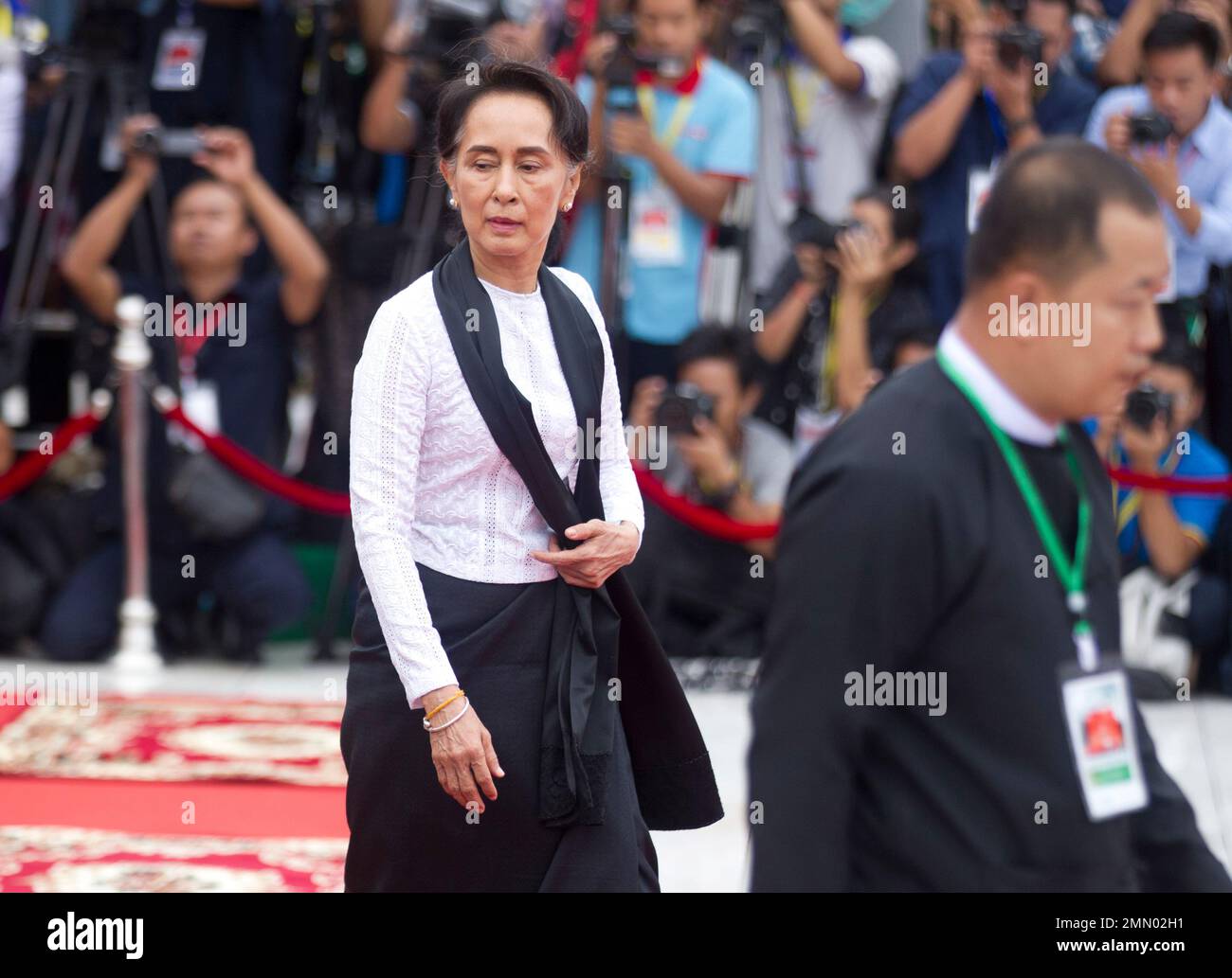 Myanmar's leader Aung San Suu Kyi walks as she lays flower basket at ...