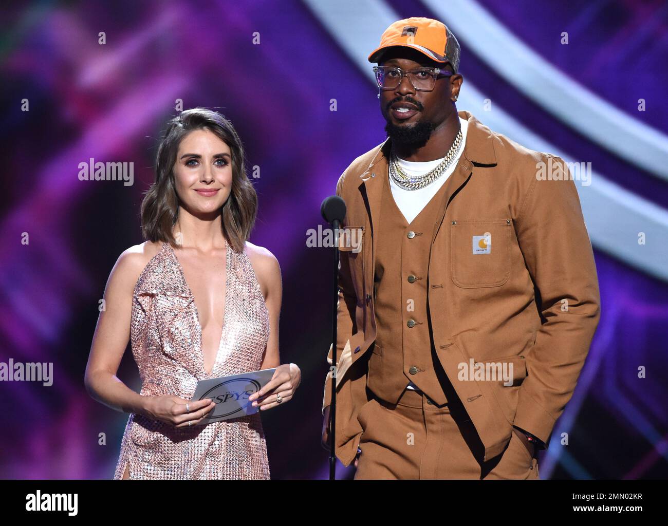 NFL football player Von Miller, of the Denver Broncos, right, and ...