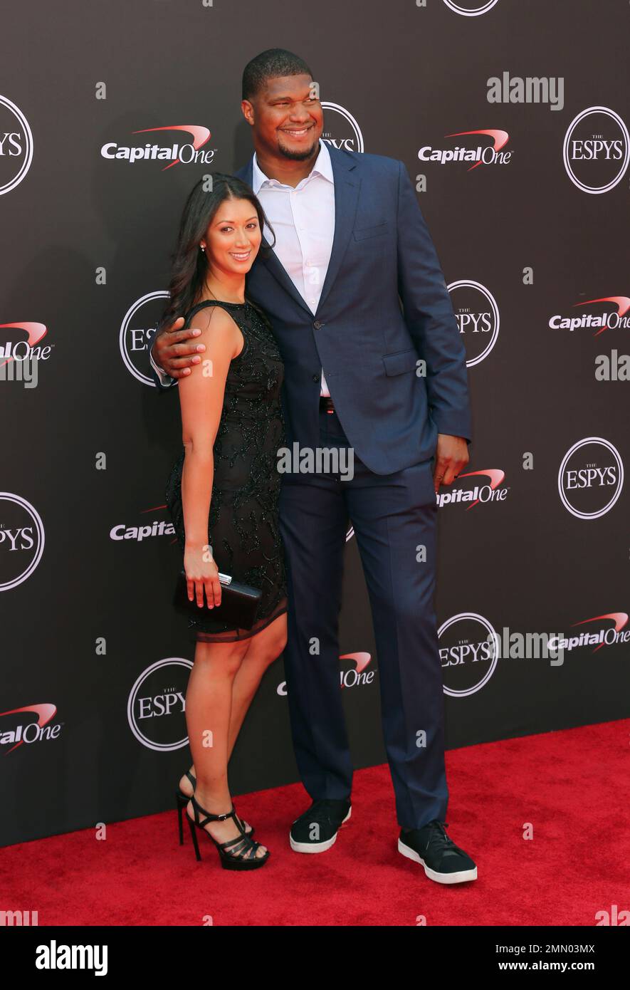 NFL football player Calais Campbell, of the Jacksonville Jaguars, right ...