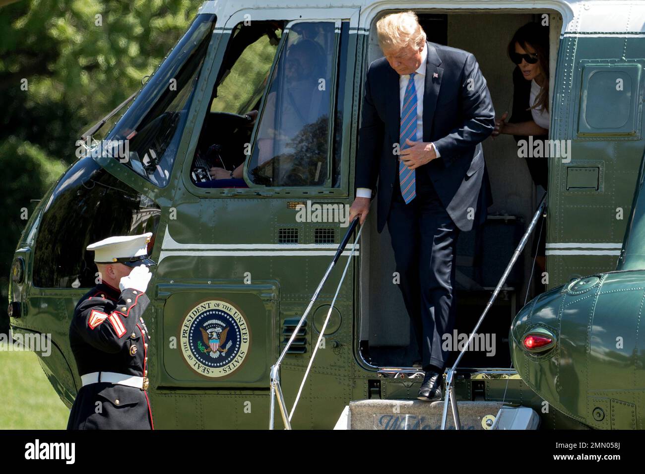 President Donald Trump and first lady Melania Trump arrive on the South ...