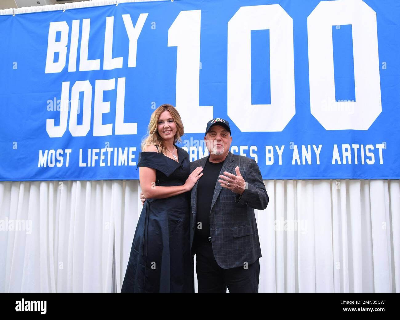 Musician Billy Joel and his wife Alexis Roderick pose together after a ...