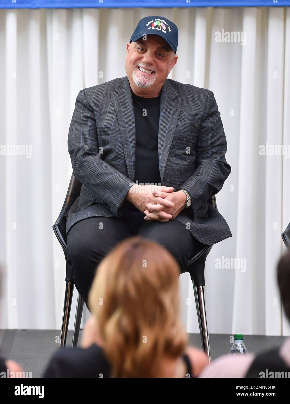 Musician Billy Joel smiles at his wife during a press conference to ...