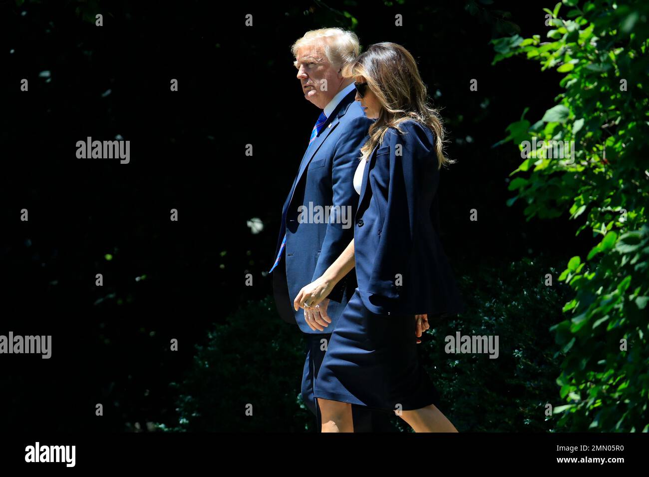 President Donald Trump and first lady Melania Trump, leave the White ...