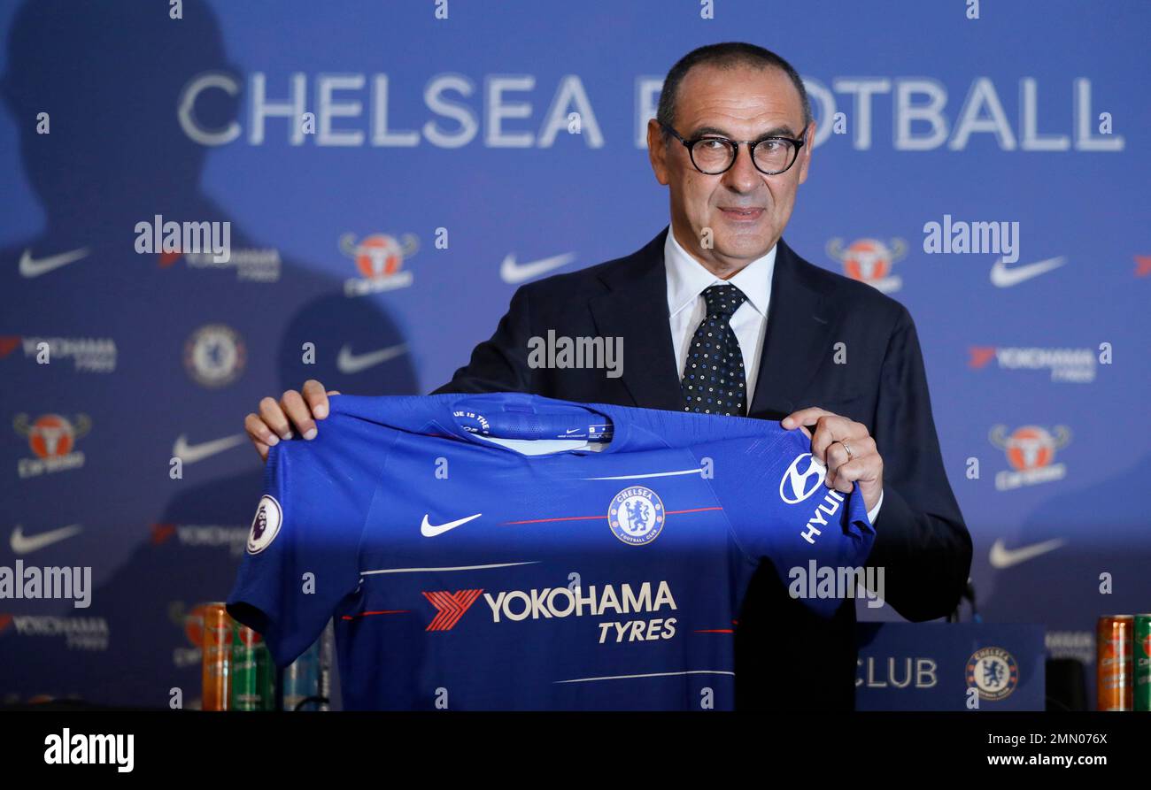 Maurizio Sarri, the new Chelsea soccer team manager, holds up a jersey ...