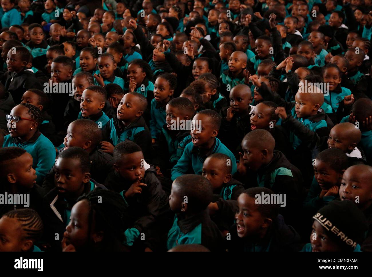 Children attend a special assembly to mark Mandela Day, at Melpark ...