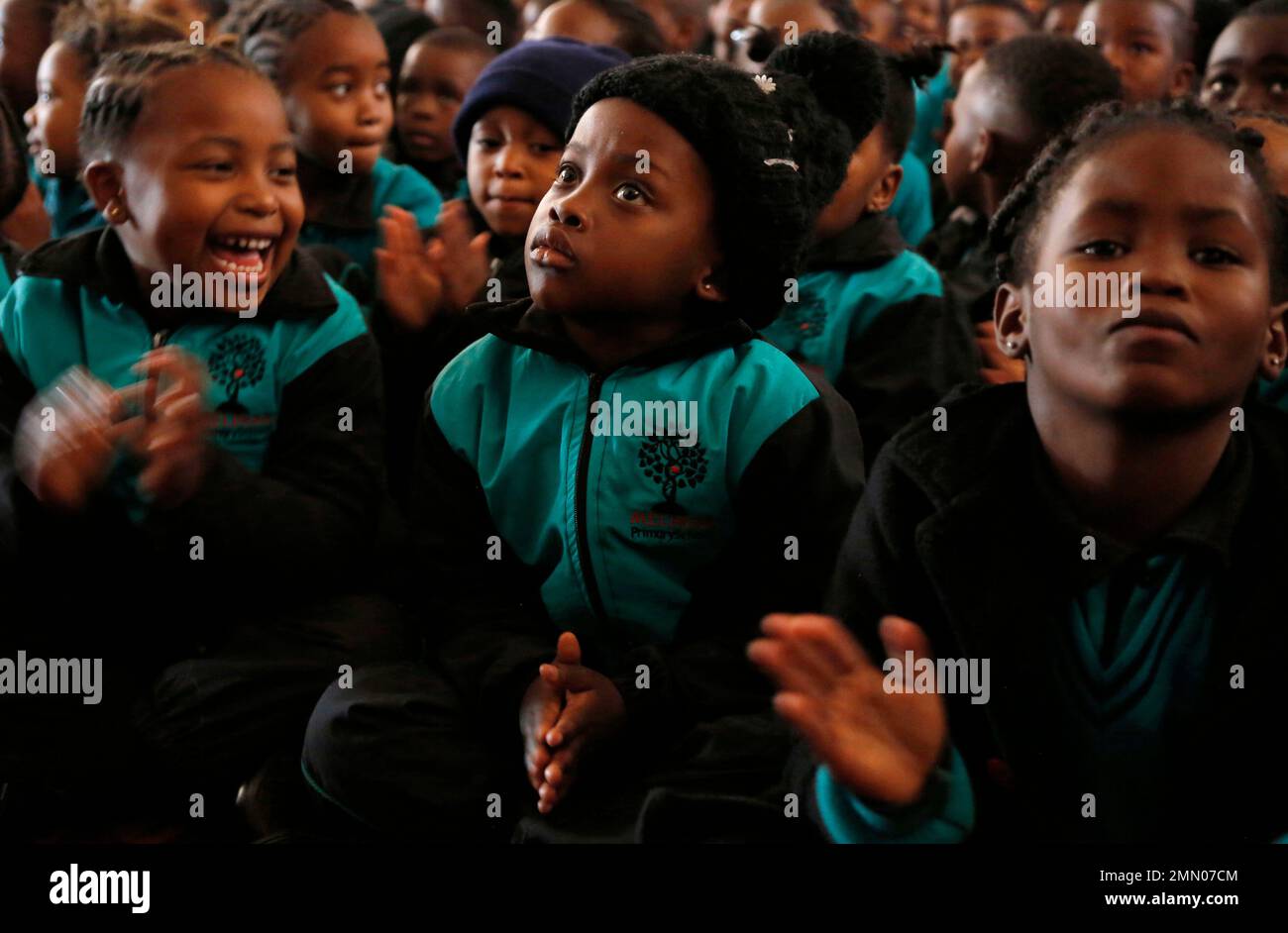 Children attend a special assembly to mark Mandela Day, at Melpark ...