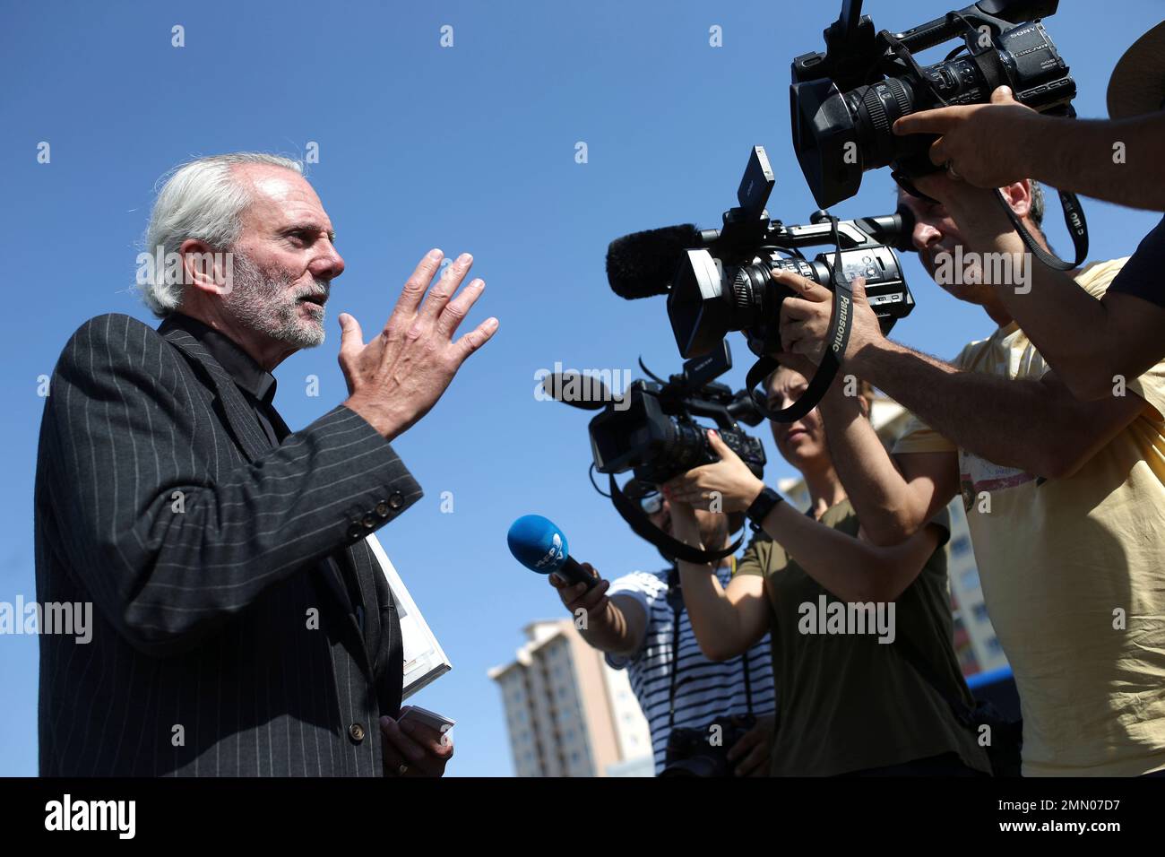 U.S. pastor Bill Devlin talks to members of the medias as he arrives to show his support at a ...