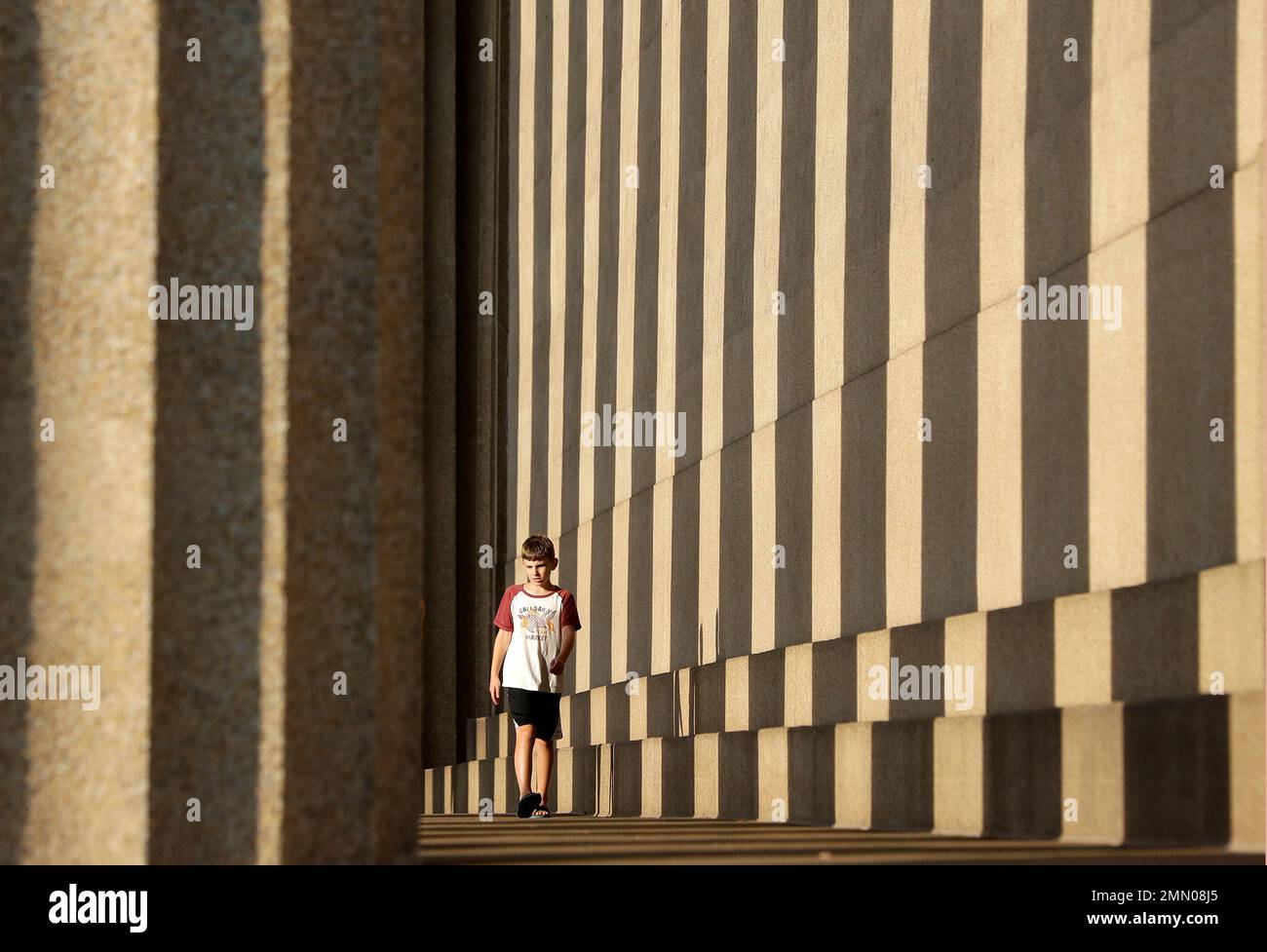 Owen Fraboni, 10, of Bethlehem, Pa., walks between shadows cast by ...