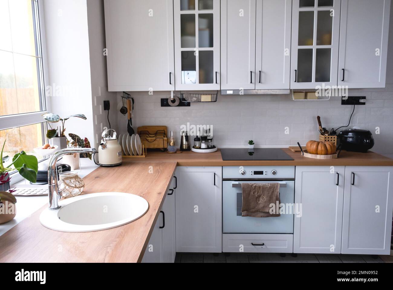 White cozy kitchen in Scandi loft style. Home interior, dining room ...