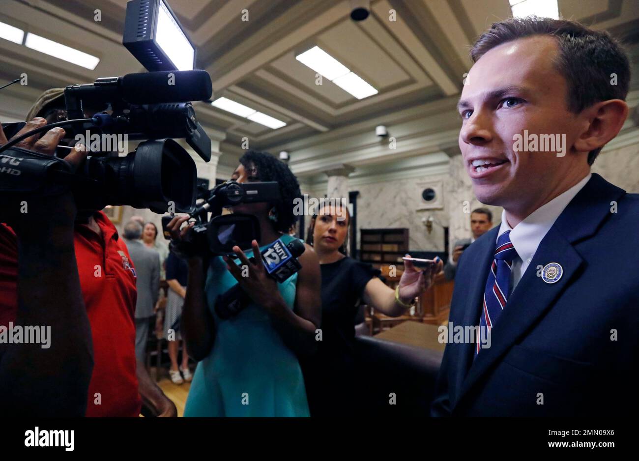 New Mississippi State Auditor Shad White, right, speaks to reporters ...
