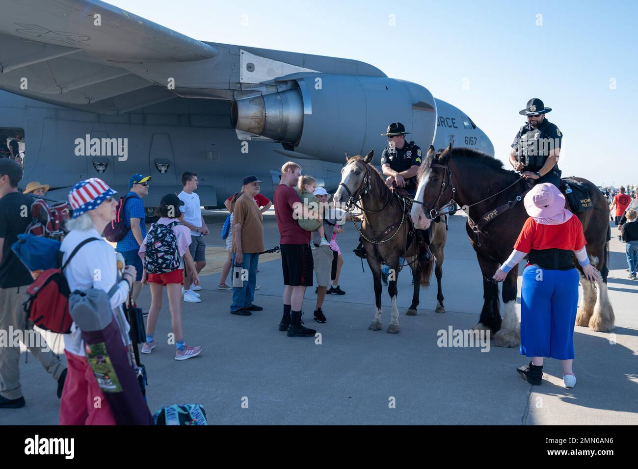 Visitors enjoy the Frontiers in Flight airshow at McConnell Air Force ...