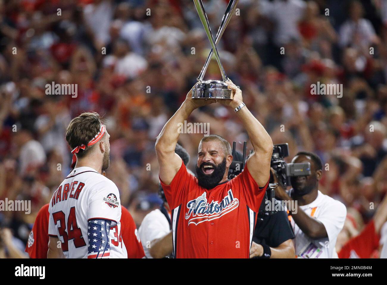 Ron Harper holds his son Washington Nationals Bryce Harper's trophy ...