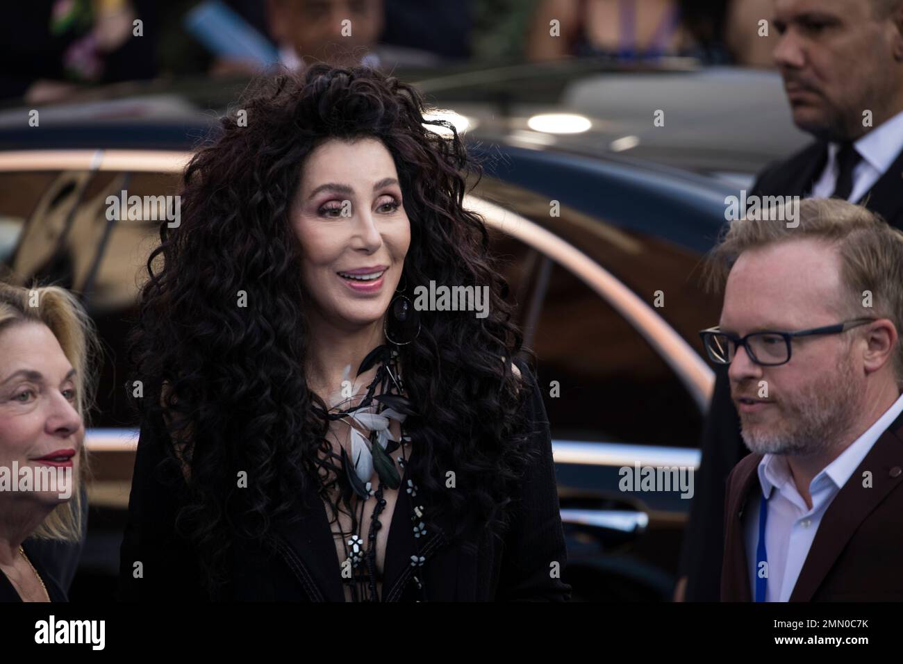 Cher poses for photographers upon arrival at the premiere of the film ...