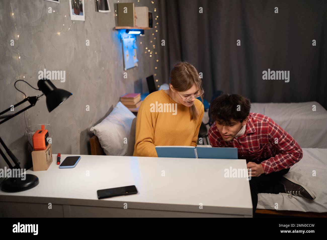 College students prepare for exam together in dormitory room Stock ...