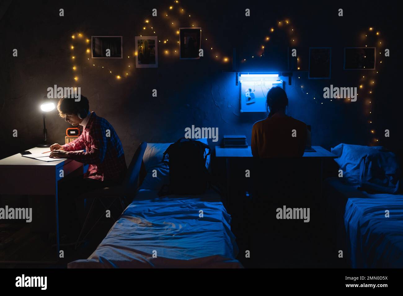 Serious college students studying in dormitory at night Stock Photo - Alamy