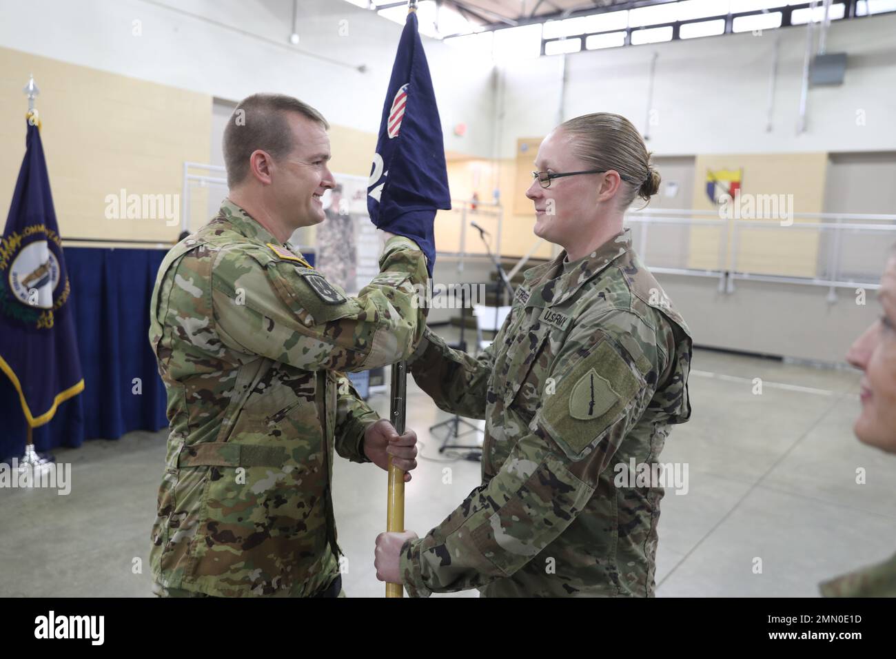Lt. Col Gabriel Spicer, 751st Troop Commander, hands the guide on to ...
