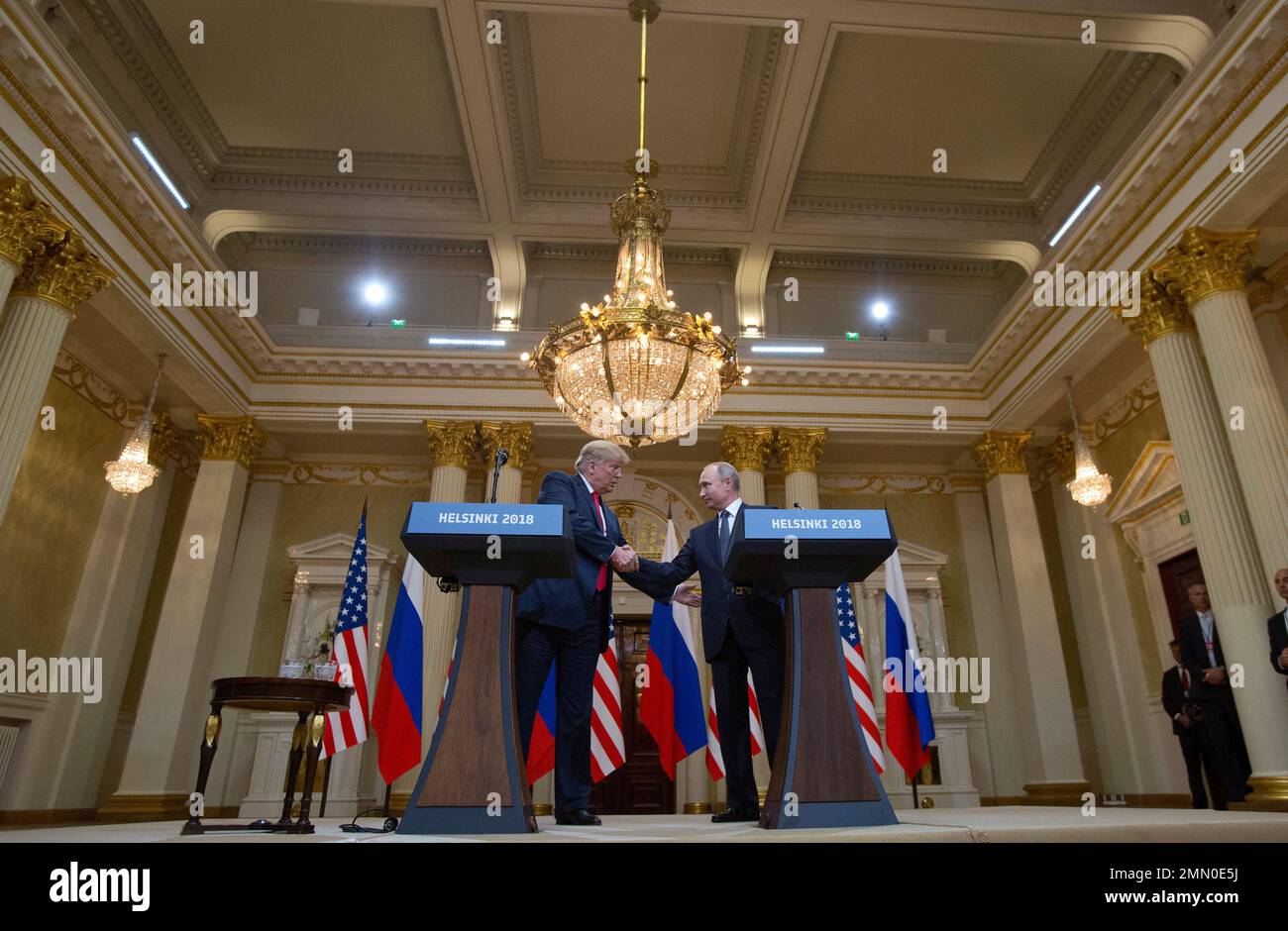 U.S. President Donald Trump and Russian President Vladimir Putin shake ...