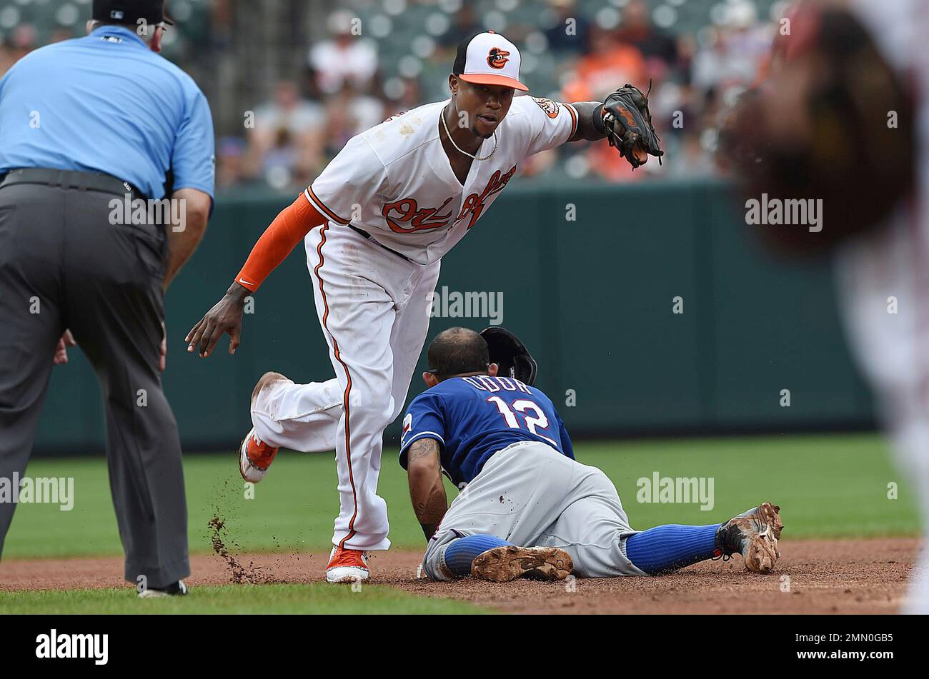 Texas Rangers' Roughned Odor (12) slides into second after being tagged ...