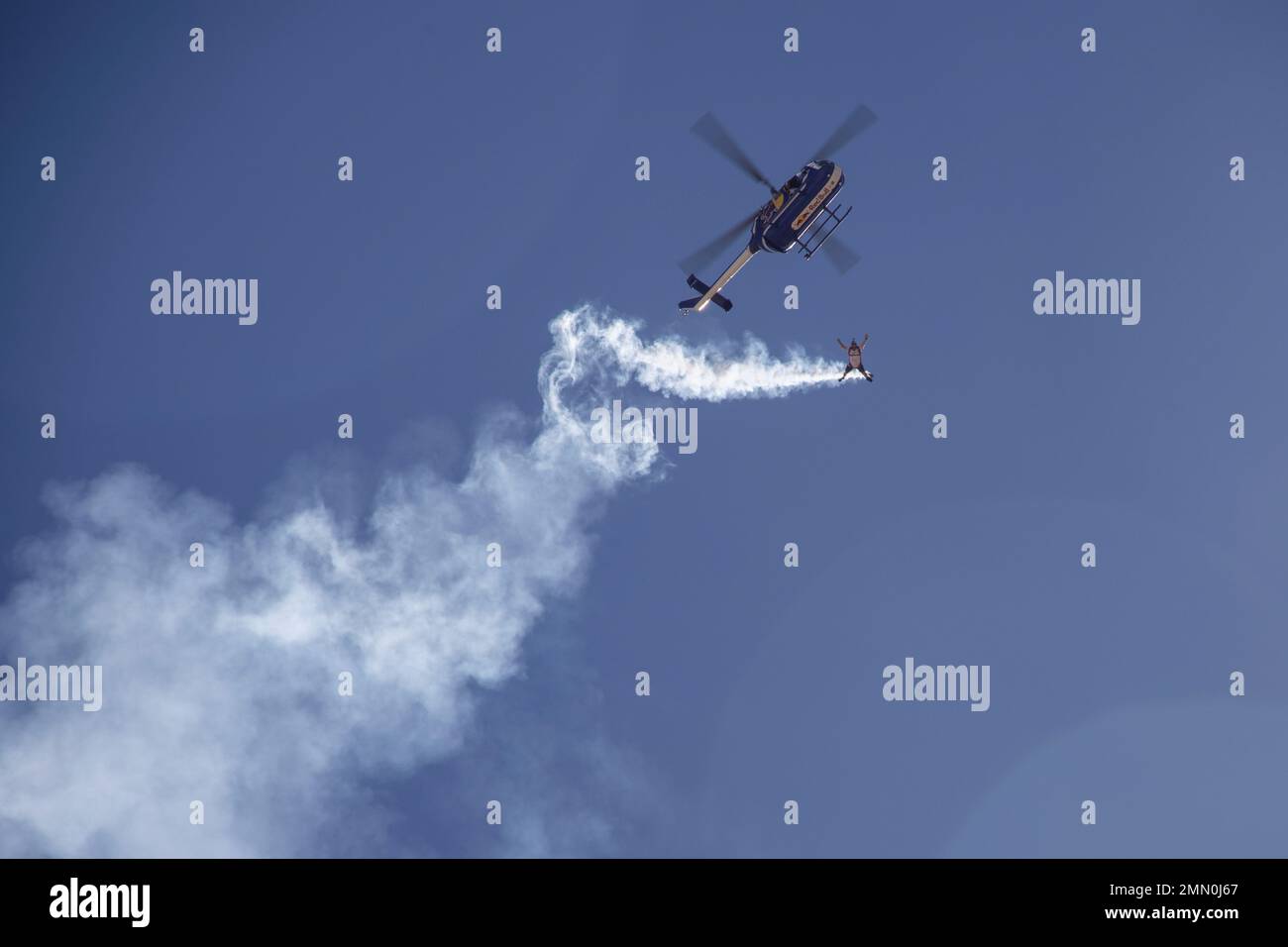 A member of the Red Bull Air Force team conducts an aerial jump out of ...