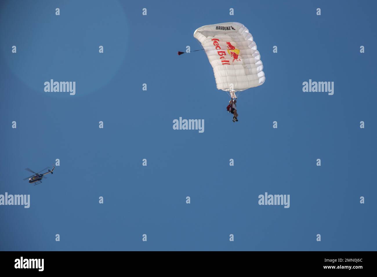 A member of the Red Bull Air Force team conducts an aerial jump out of ...