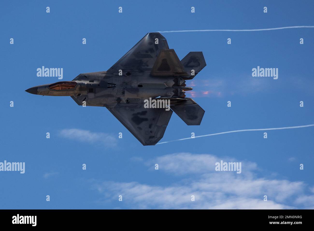 A U.S. Air Force F-22 Raptor conducts a heritage flight during the 2022 ...