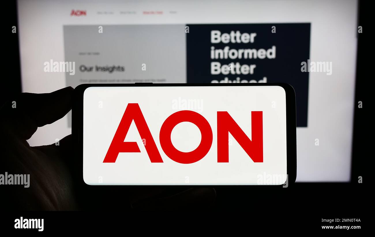 Person holding cellphone with logo of financial services company Aon ...