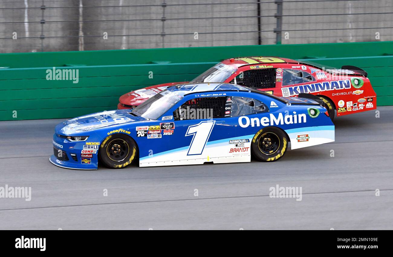 Elliott Sadler (1) attempts to hold off BJ McLeod (15) during a NASCAR ...