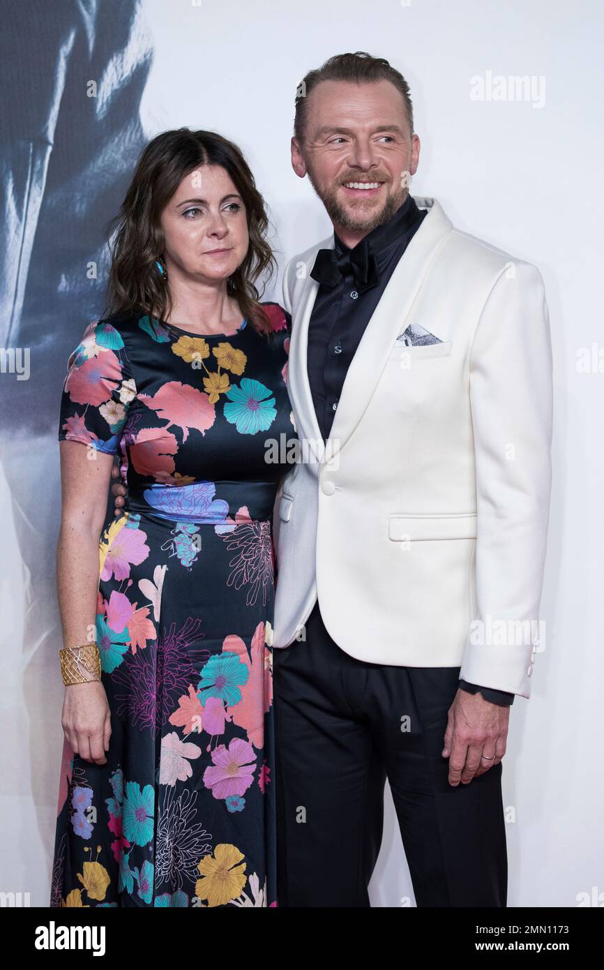 Actor Simon Pegg, right, and his wife Maureen Pegg pose for photographers upon arrival at the ...