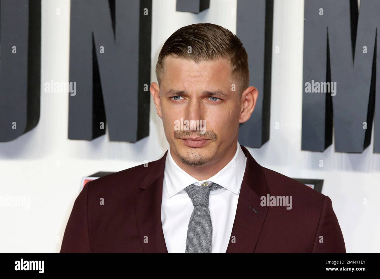 Actor Frederick Schmidt poses for photographers on arrival at the ...