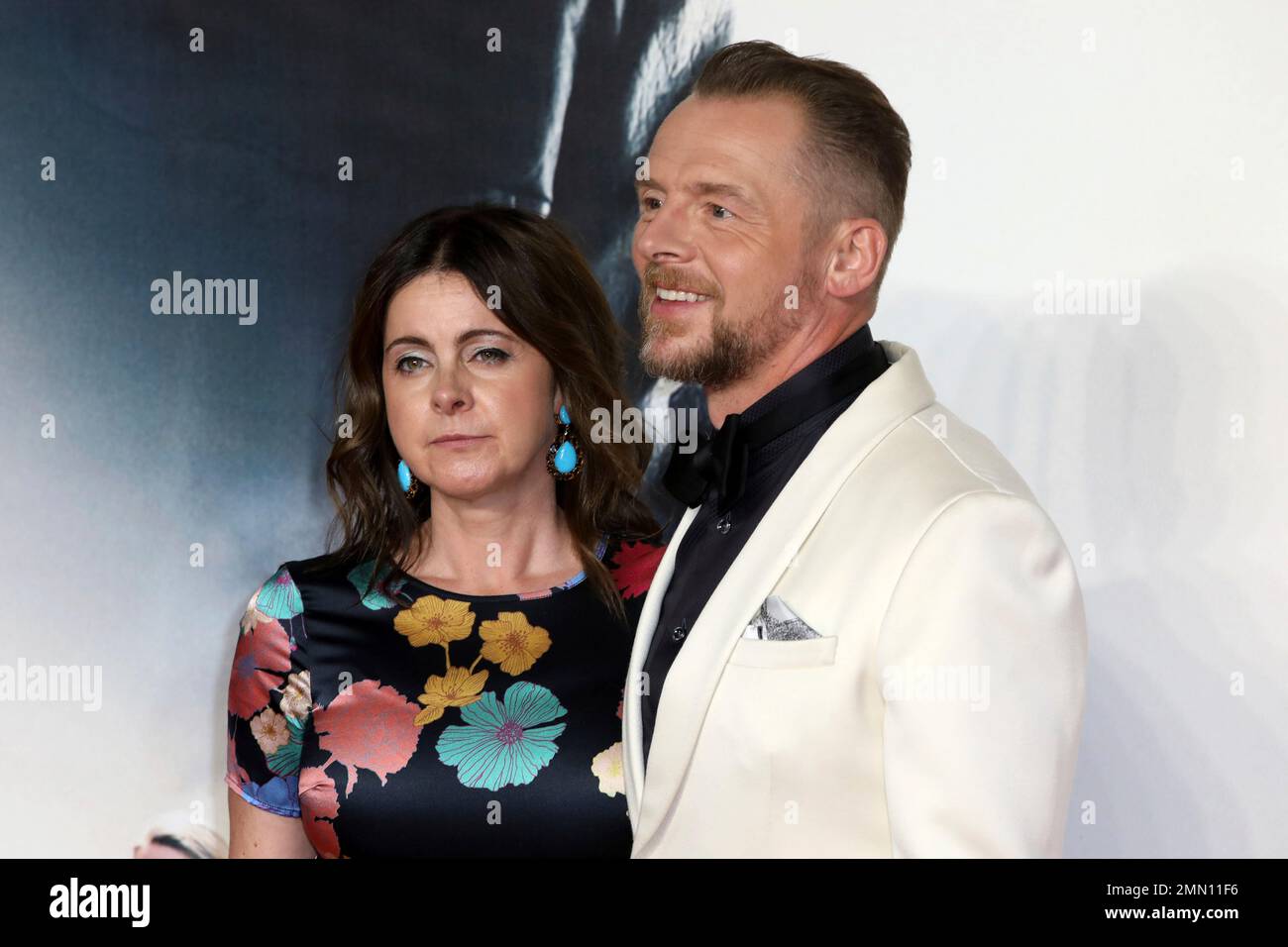Actor Simon Pegg and partner Maureen Pegg pose for photographers on ...