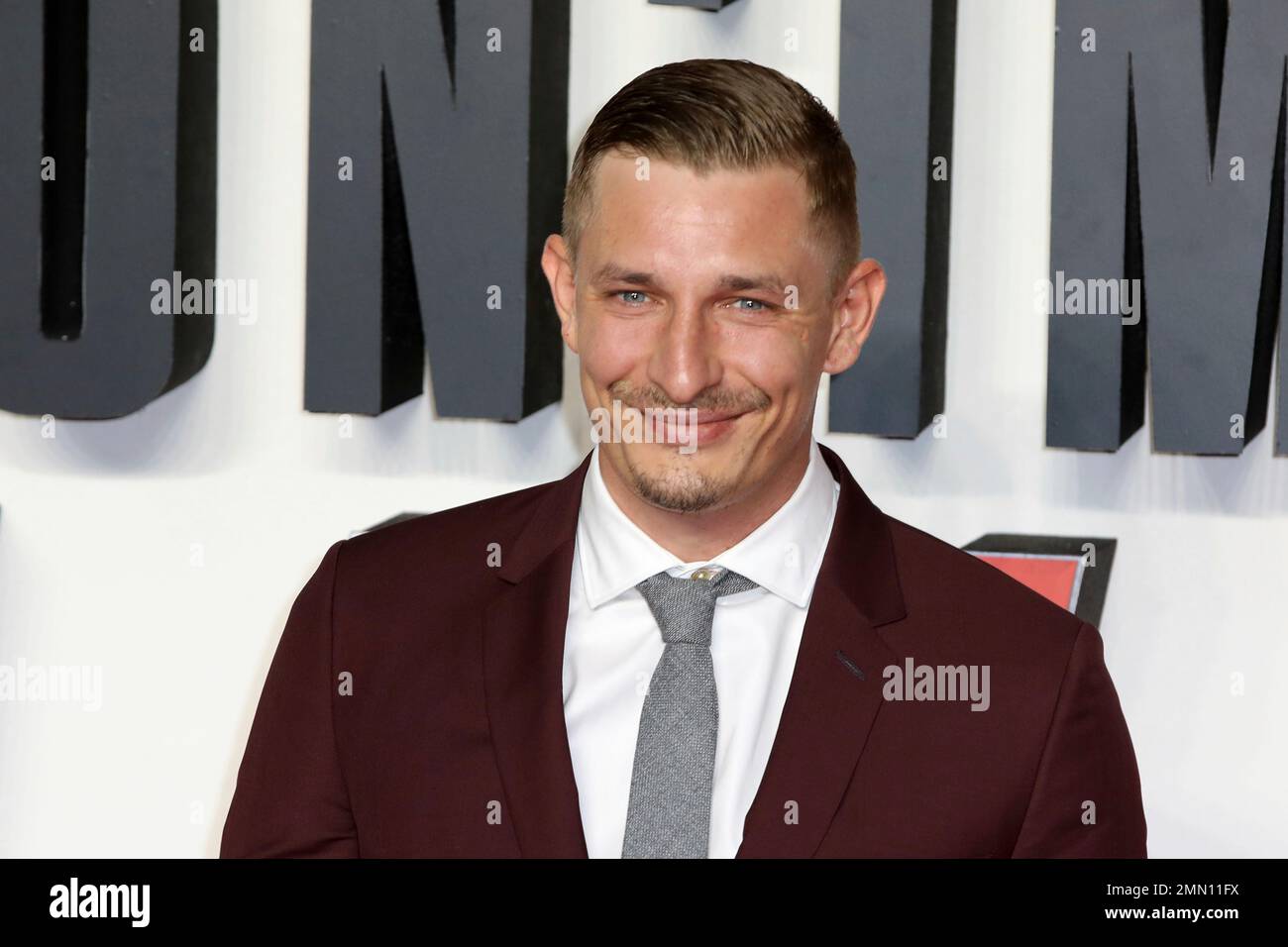 Actor Frederick Schmidt poses for photographers on arrival at the ...