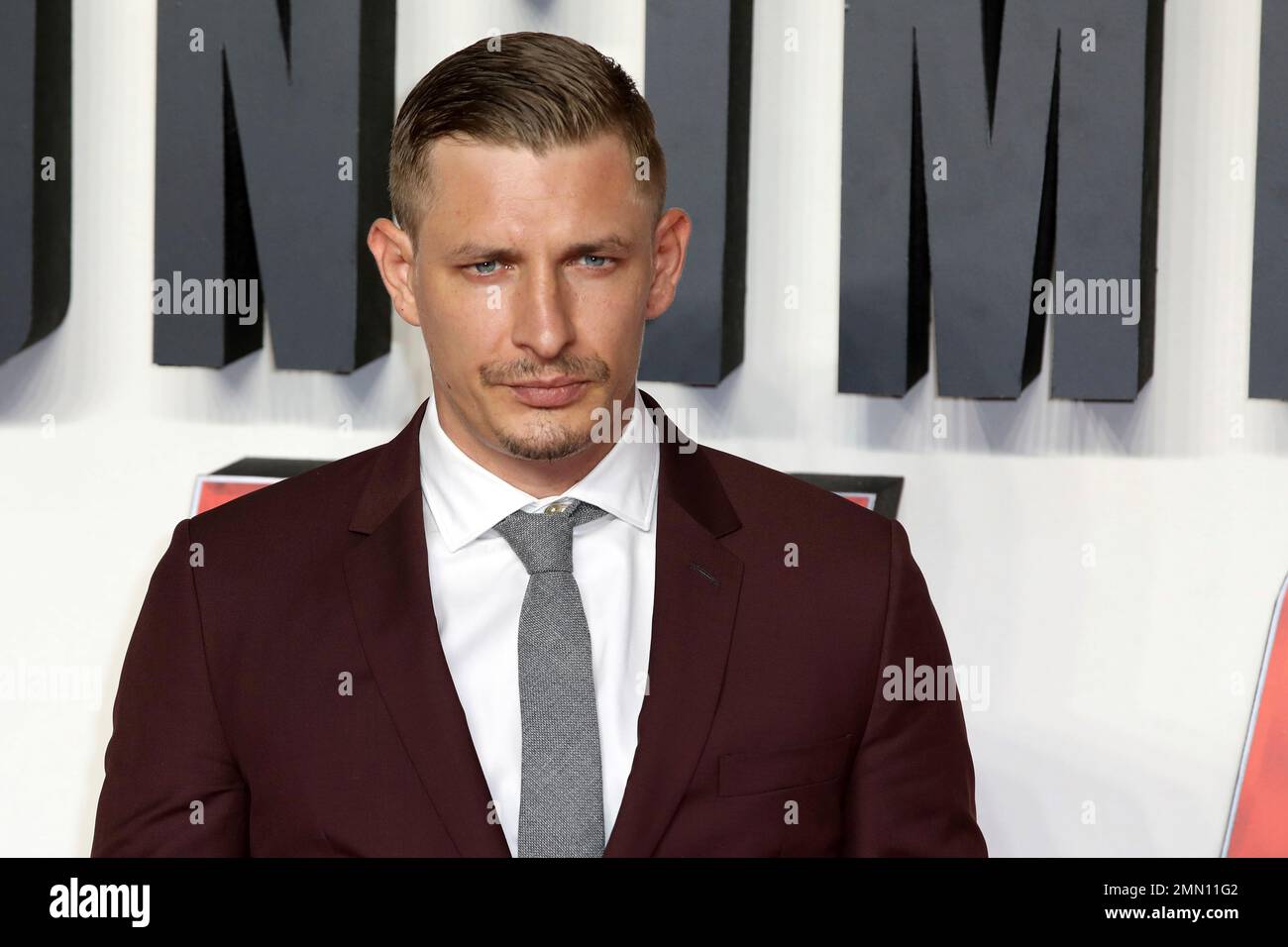 Actor Frederick Schmidt poses for photographers on arrival at the ...