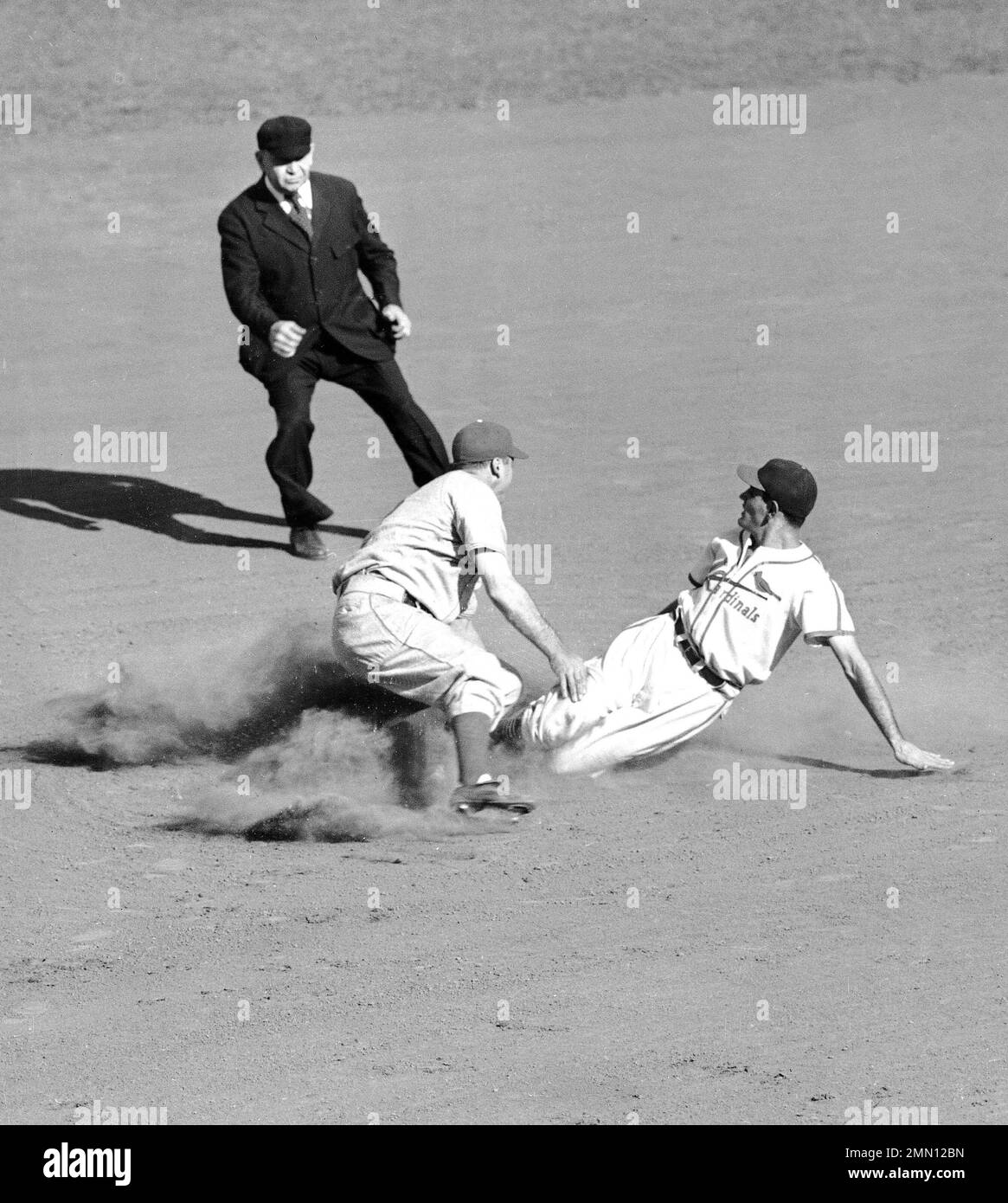 Billy Herman of the Dodgers puts out Frank Crespi of the Cardinals as ...