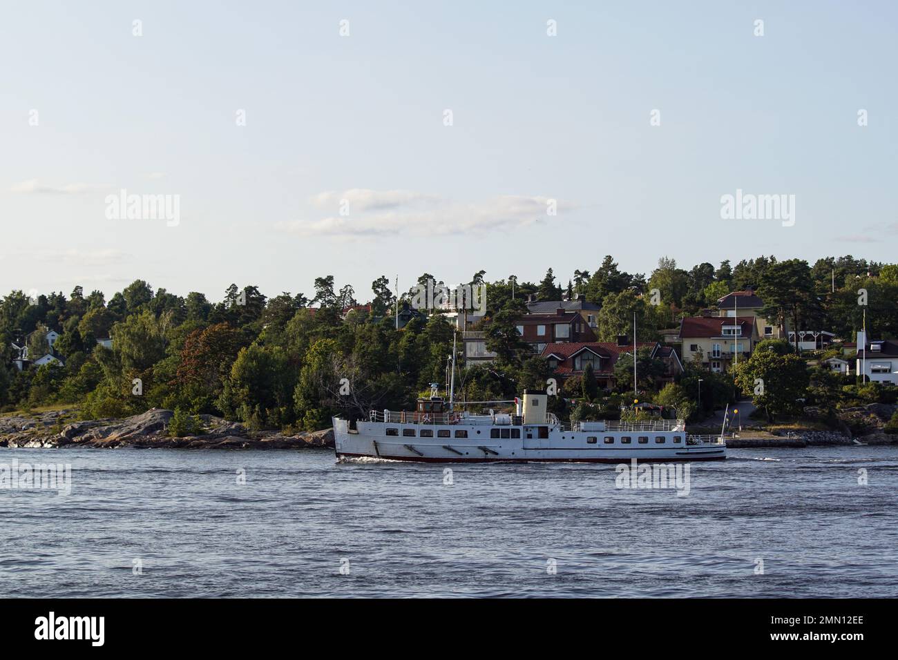 steamboat in front of island in the archipelago Stock Photo - Alamy