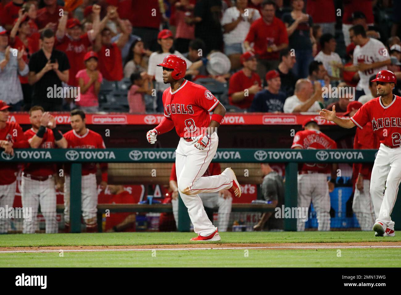 Los Angeles Angels' Justin Upton comes around after hitting a three-run ...
