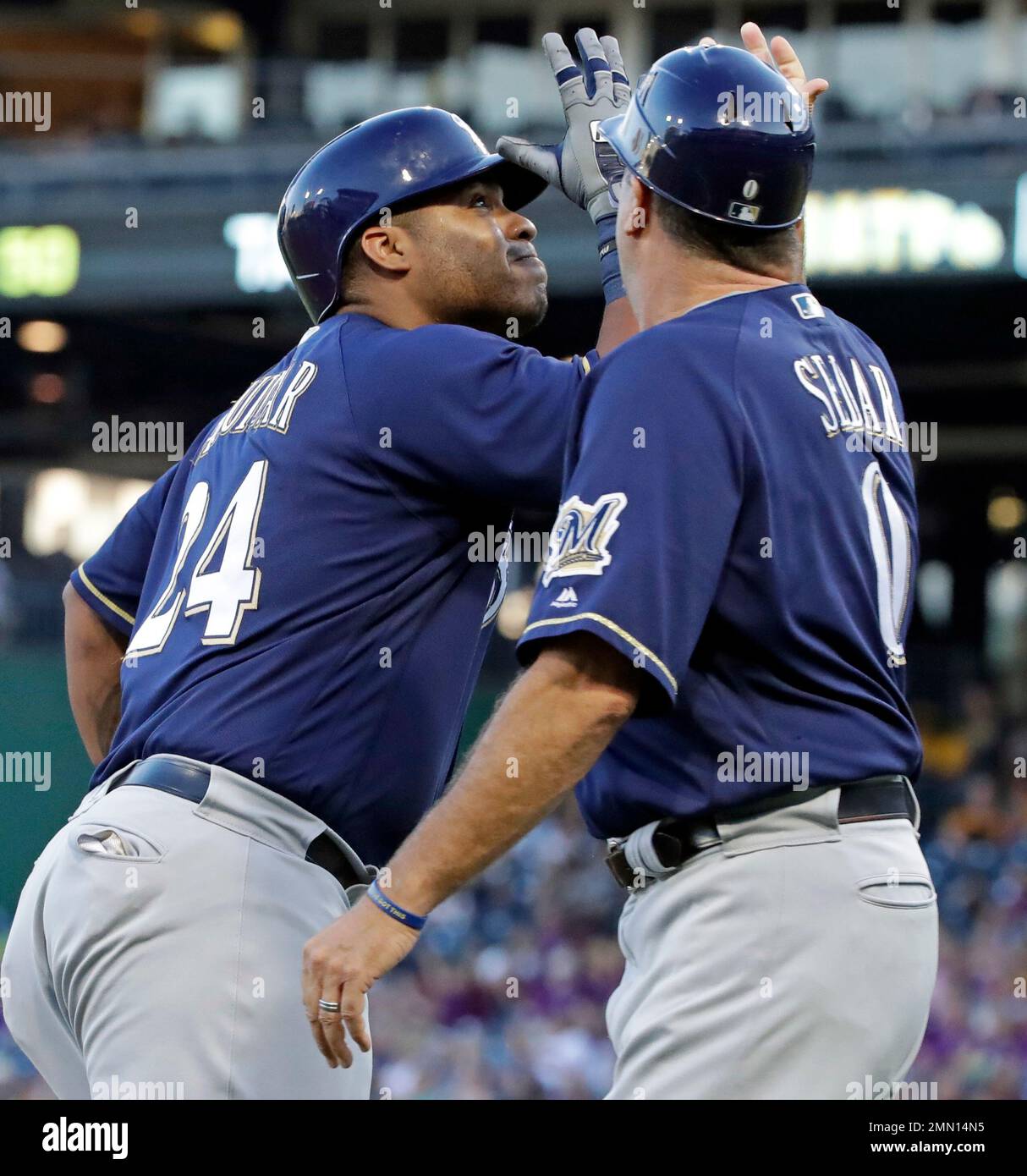 Milwaukee Brewers' Jesús Aguilar (24) rounds third to greetings from ...