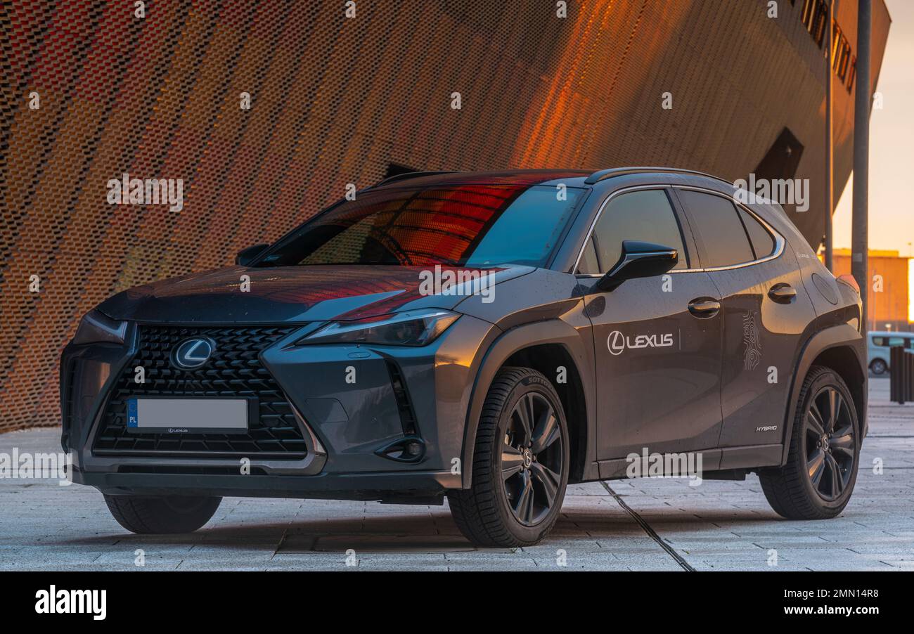 Lexus UX hybrid SUV against the background of a modern building in the ...