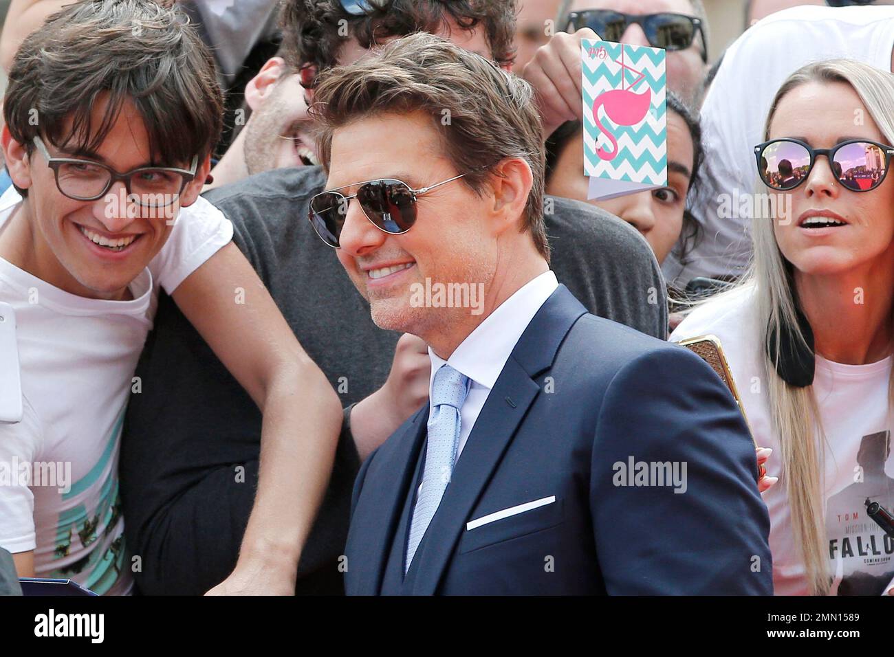 Actor Tom Cruise poses for photographs with fans upon arrival at the ...