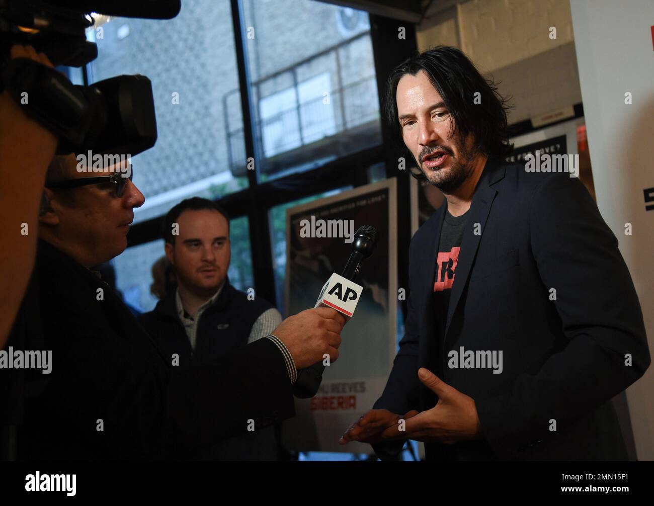 Actor Keanu Reeves, right, speaks with Associated Press entertainment ...