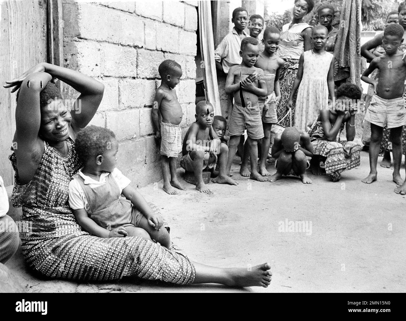 Opanga Pauline Lumumba and her son Roland Gilbert, 2 1/2, weep in front ...