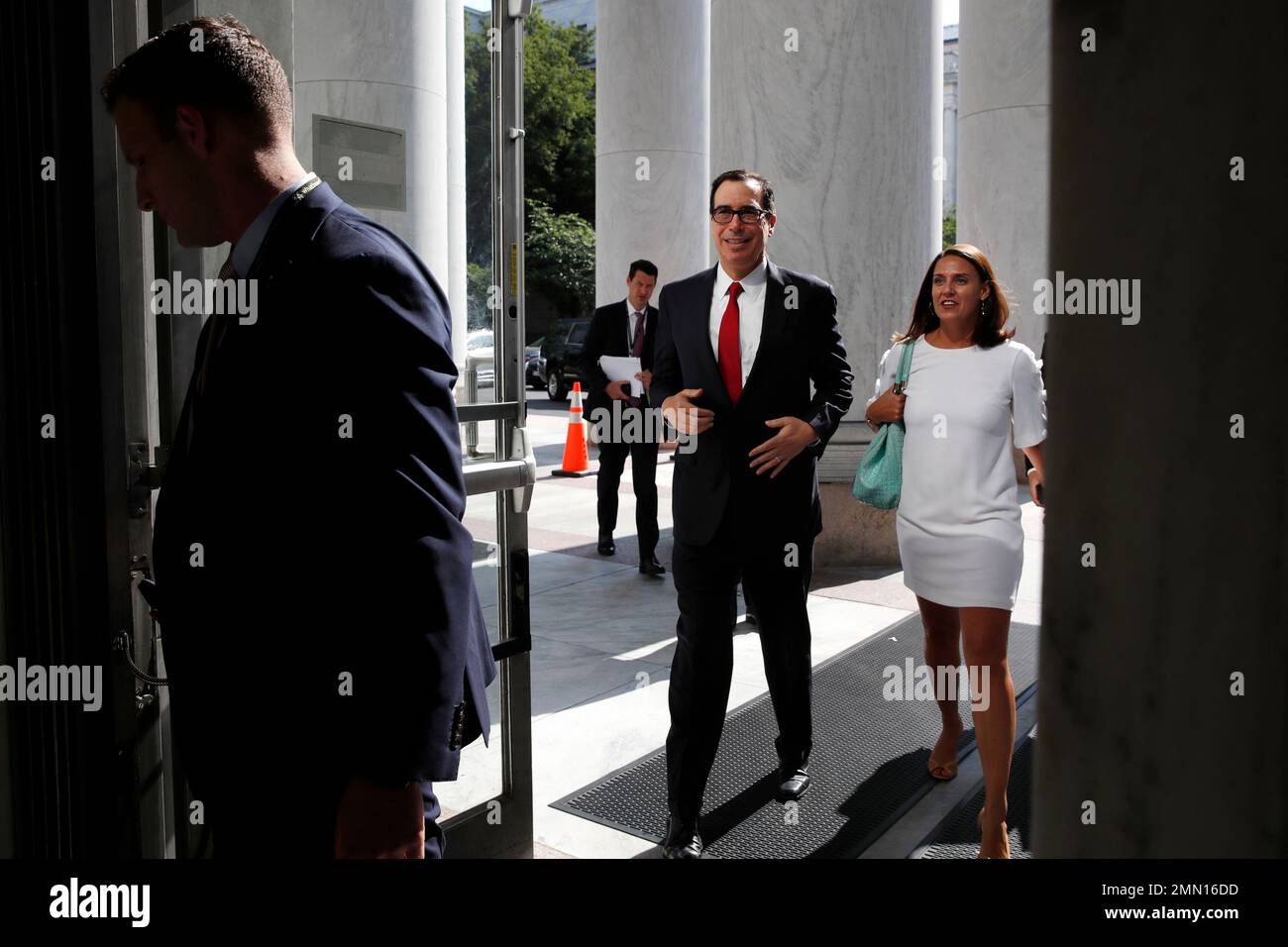 Treasury Secretary Steven Mnuchin, center, arrives with Molly Meiners ...