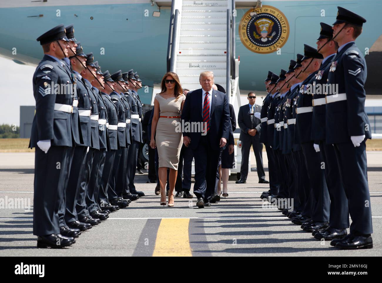 U.S. President Donald Trump and first lady Melania Trump step off Air ...