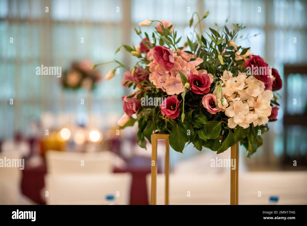 Wedding flowers set up in a restaurant. A wedding colorful bouquet ...