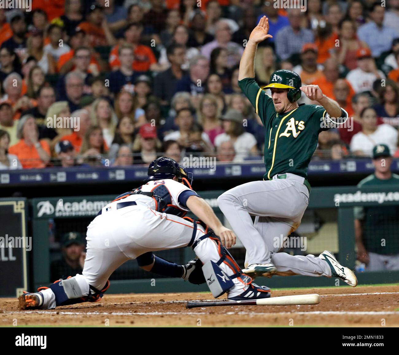 Oakland Athletics' Stephen Piscotty, right, is tagged out by Houston ...