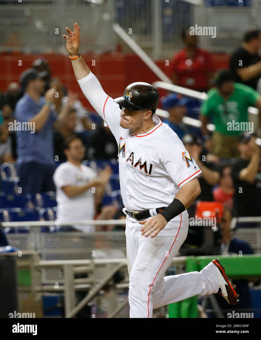 Miami Marlins' Justin Bour celebrates as he heads for home after ...